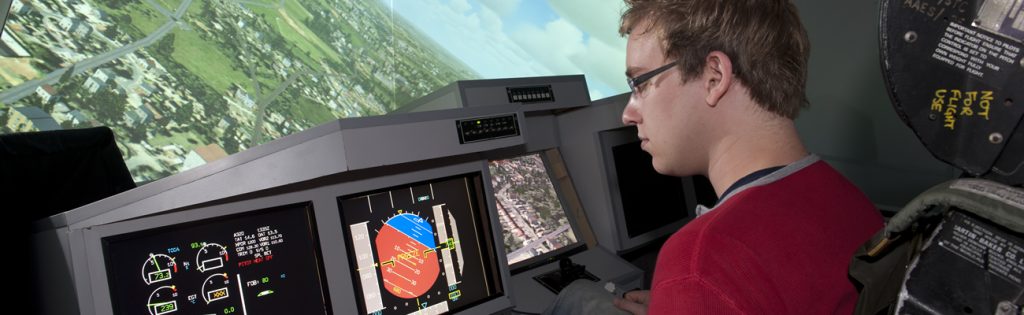 male-student-using-flight-simulator-in-flight-impact-statement